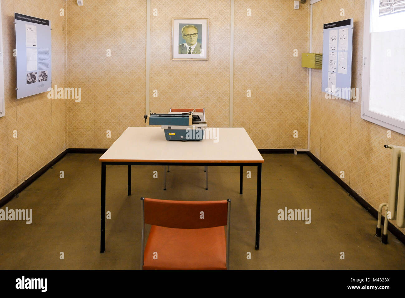 Exhibition of interrogation room with typewriter on the table and ...