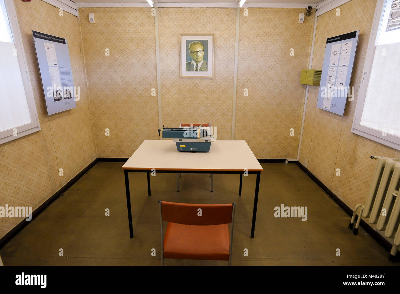 Exhibition of interrogation room with typewriter on the table and ...