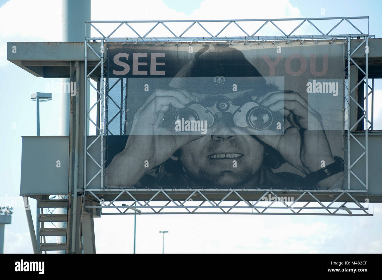 Observation bridge with picture of GDR border guard See you in former ...