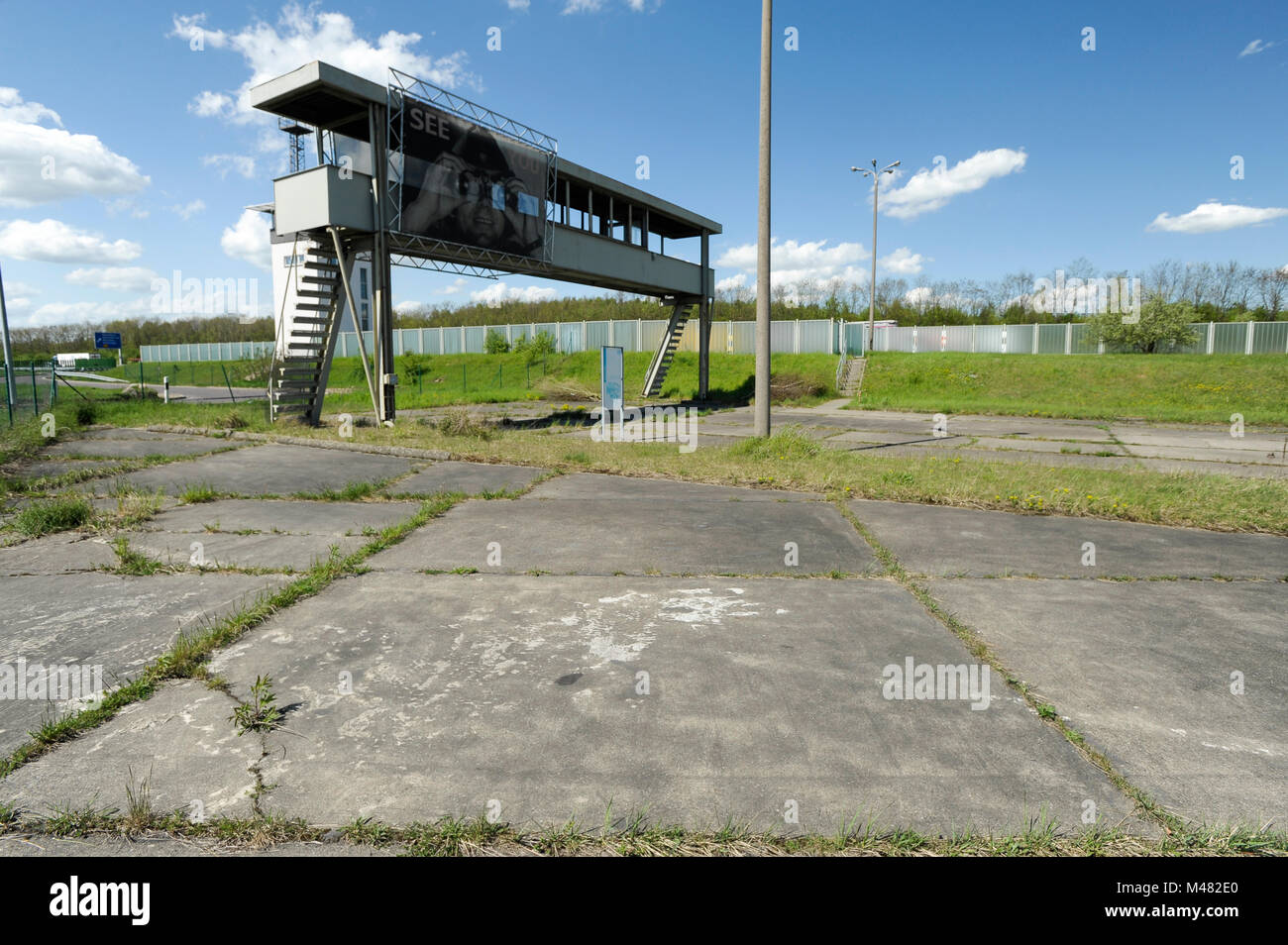 Observation bridge with picture of GDR border guard See you in former ...