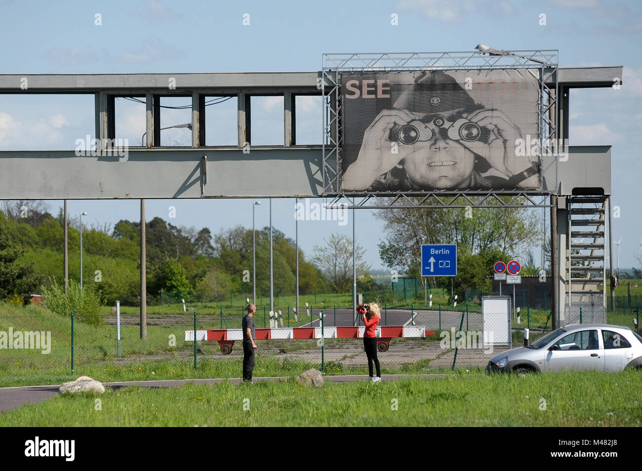 Observation bridge with picture of GDR border guard See you in former ...