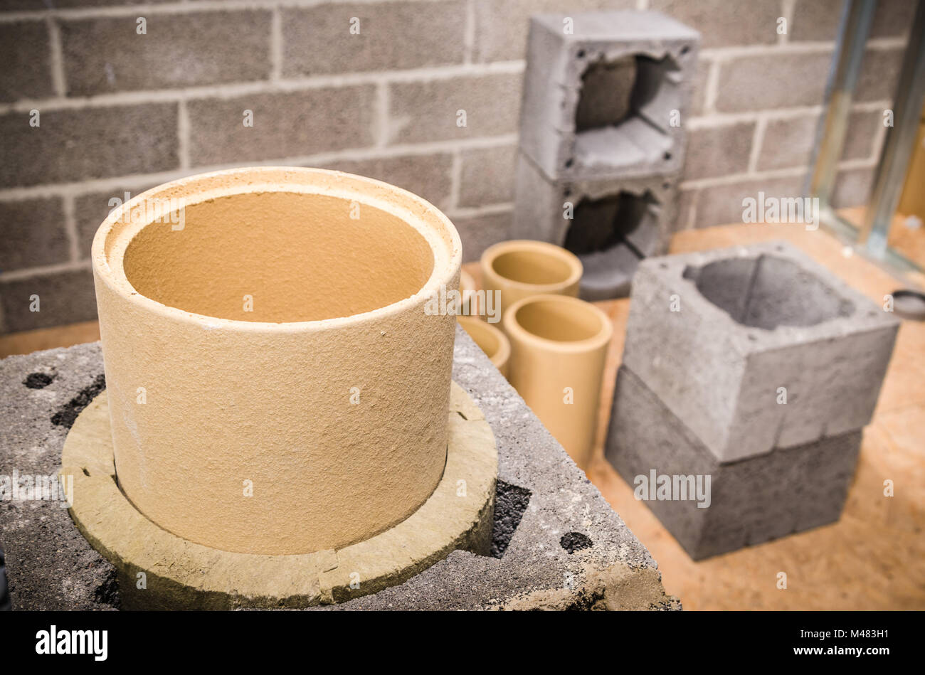 Construction of modular ceramic chimney in the house Stock Photo - Alamy