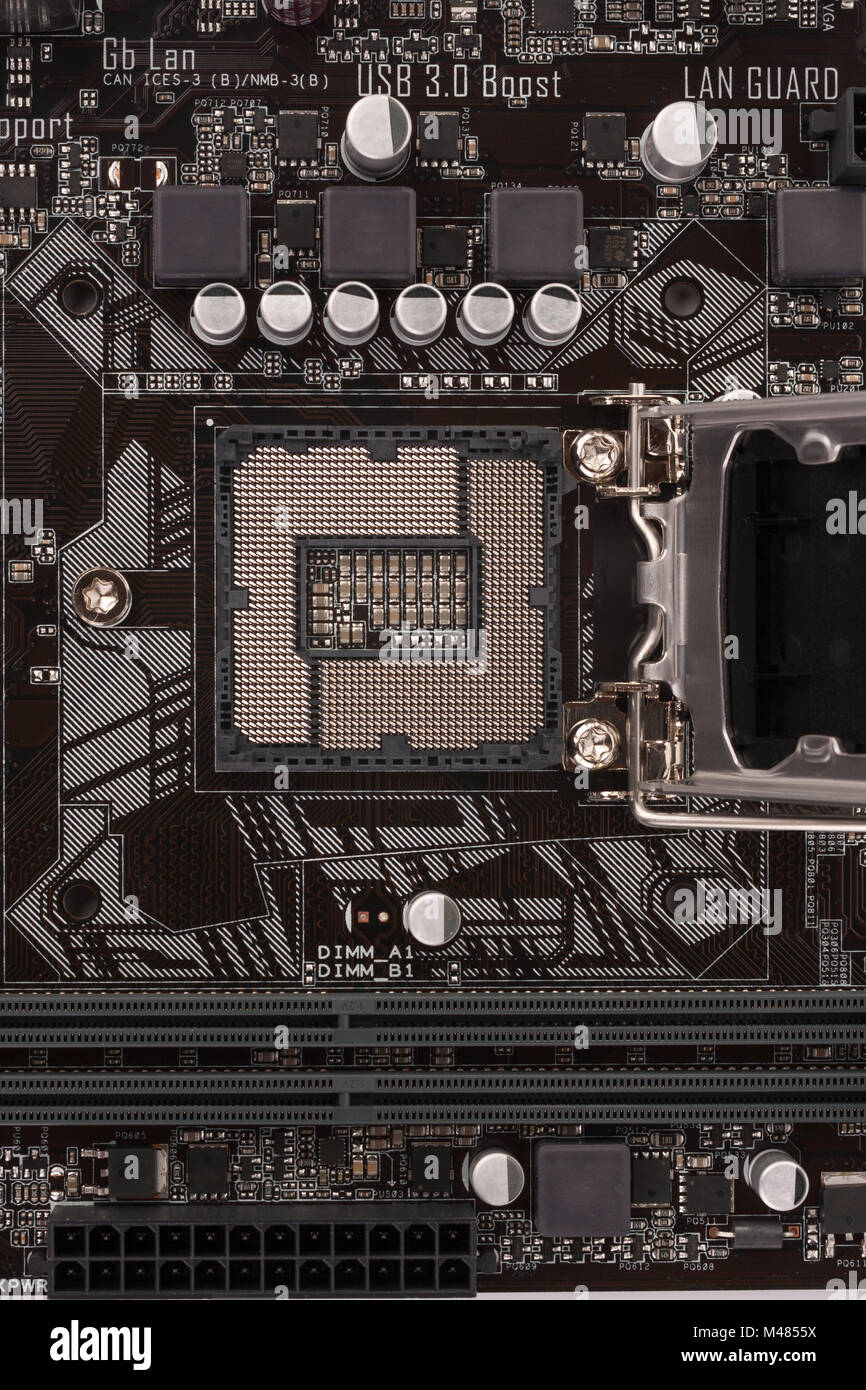 Open socket for processor on motherboard for office PC, close up view Stock Photo - Alamy