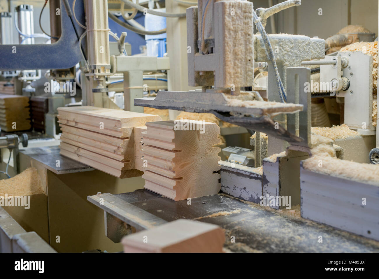 At sawmill. Shot of profiled bar during processing Stock Photo - Alamy