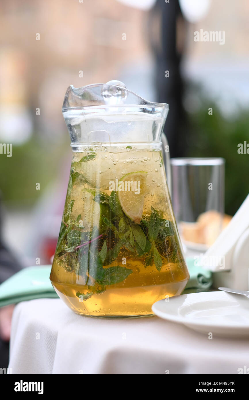 Lemonade pitcher at outdoor table Stock Photo - Alamy