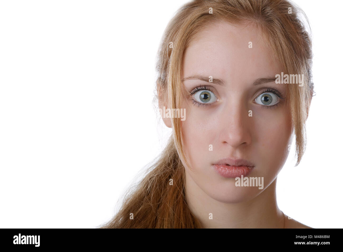 girl with eyes bulging with surprise on a white background Stock Photo ...