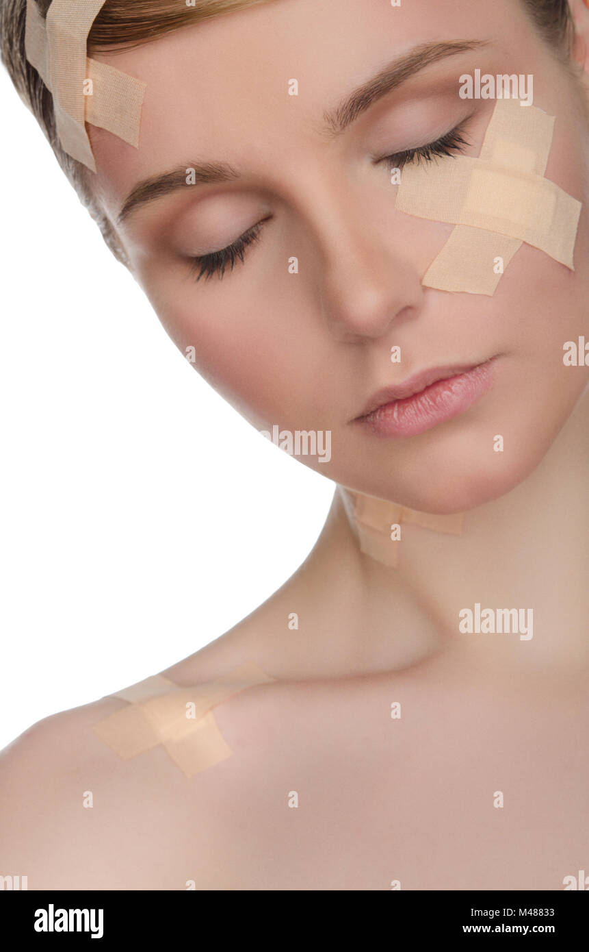 portrait of woman with medical plaster on her face Stock Photo - Alamy
