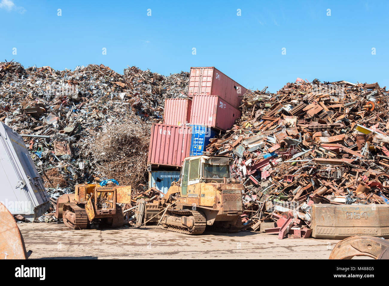 ISO standard containers swallowed by the scrap metal Stock Photo - Alamy