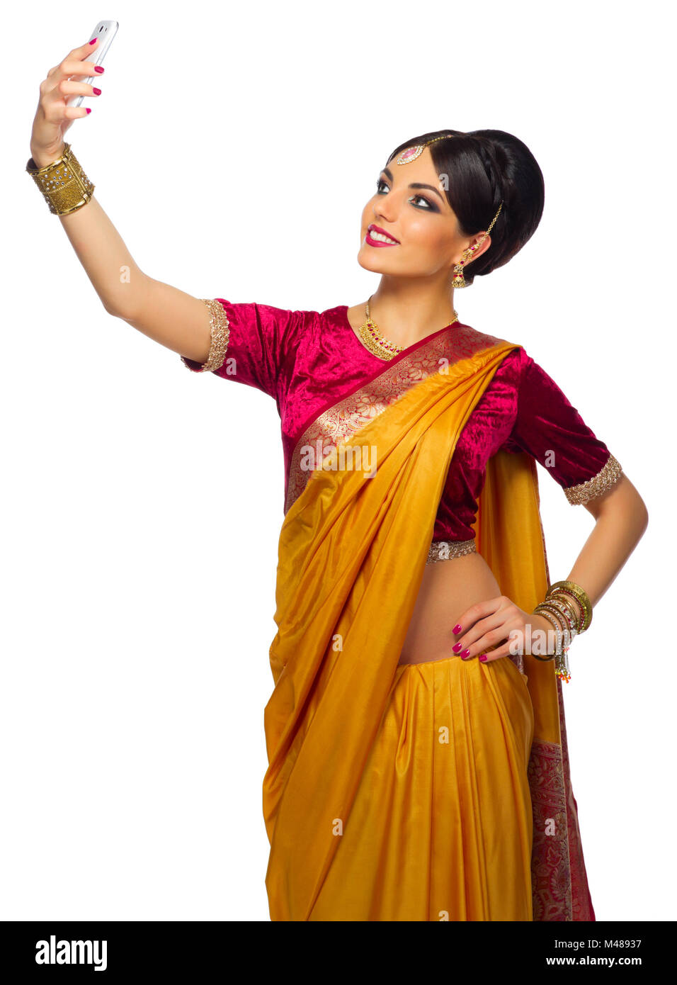 Indian young woman with mobile phone isolated Stock Photo - Alamy