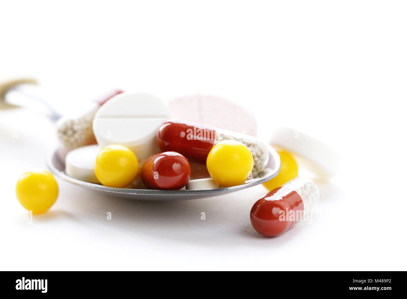 various pills and medication on a white background Stock Photo - Alamy