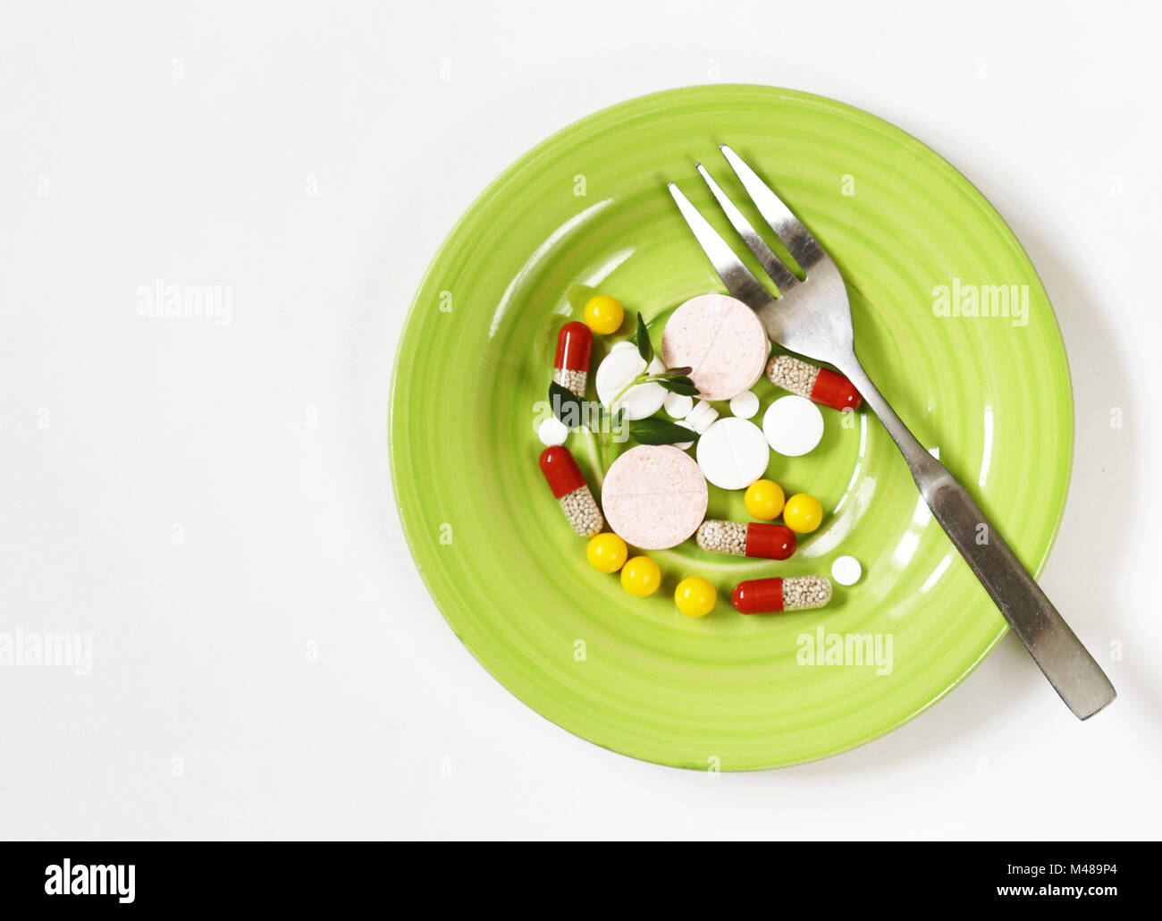 various pills and medication on a white background Stock Photo - Alamy