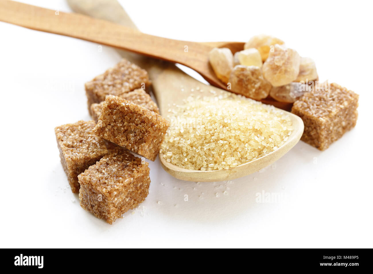 brown sugar sand and refined sugar on white background Stock Photo - Alamy