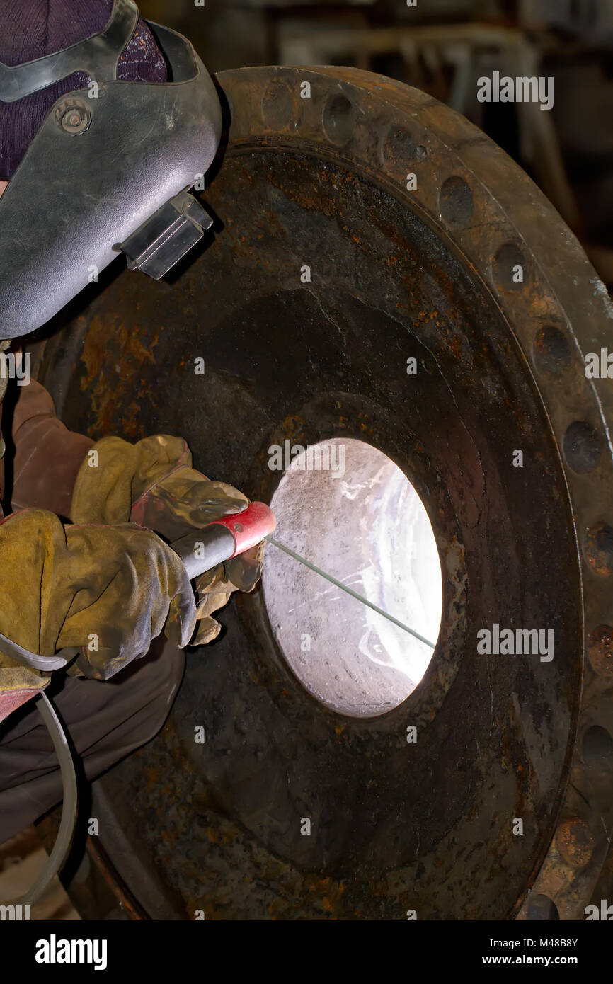 Repair of parts of the apparatus for manual arc welding Stock Photo - Alamy