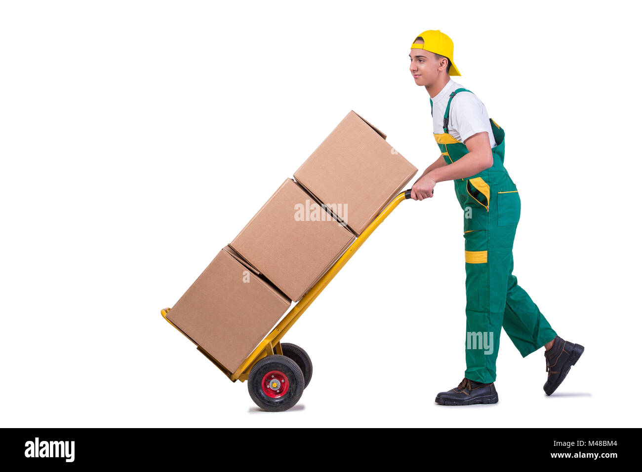 Young man moving boxes with cart isolated on white Stock Photo - Alamy