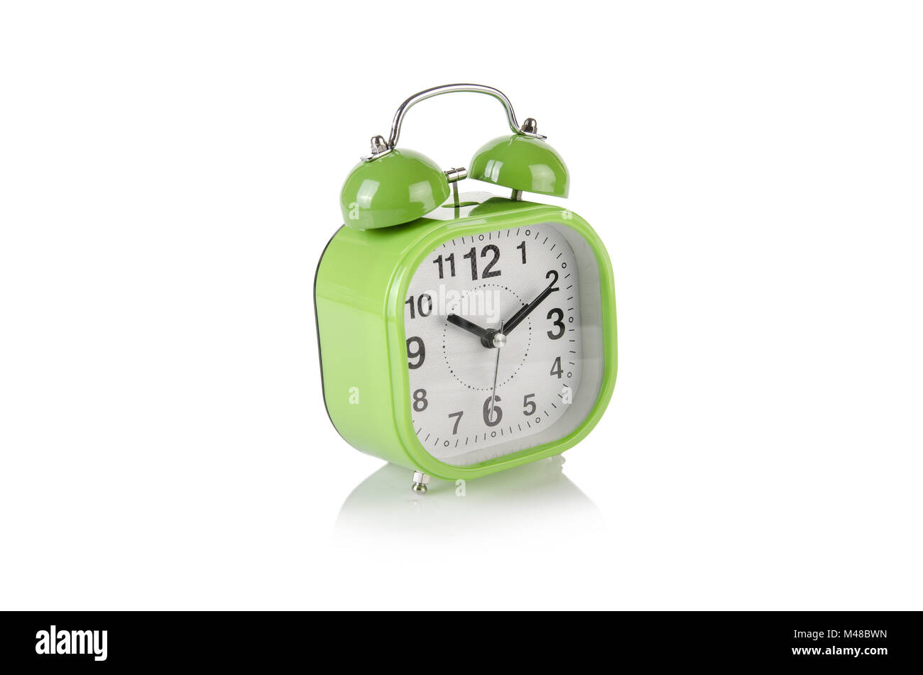 Alarm clock in time concept isolated on white Stock Photo - Alamy