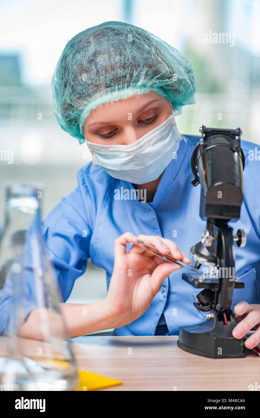 Experienced lab assistant working on chemical solutions Stock Photo - Alamy