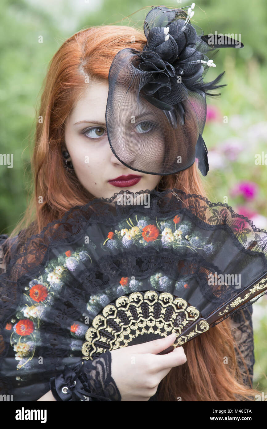 Girl with fan Stock Photo - Alamy