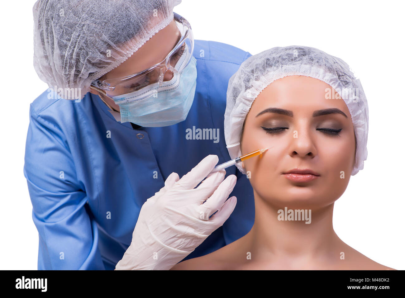 Young woman preparing for injection of botox isolated on white Stock ...