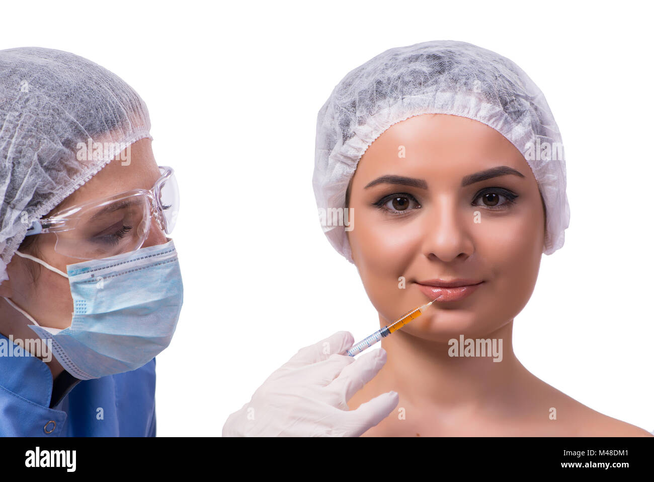 Young woman preparing for injection of botox isolated on white Stock ...