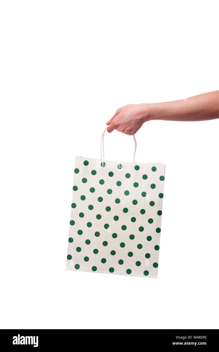 Hand holding giftbag isolated on white Stock Photo - Alamy