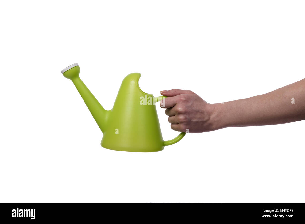 Hand holding watering can isolated on white Stock Photo - Alamy