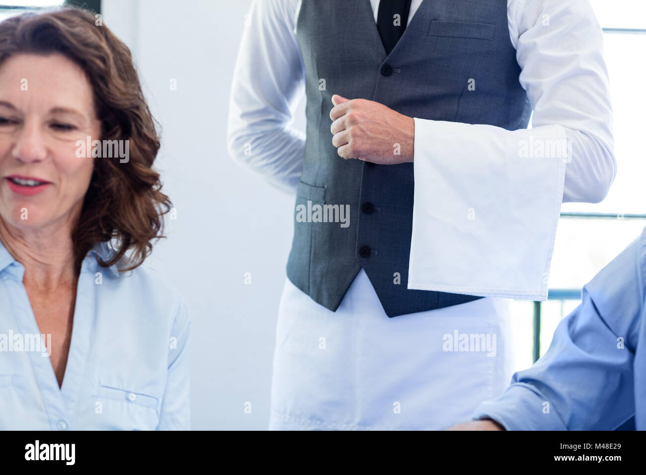 Standing next to table hi-res stock photography and images - Alamy