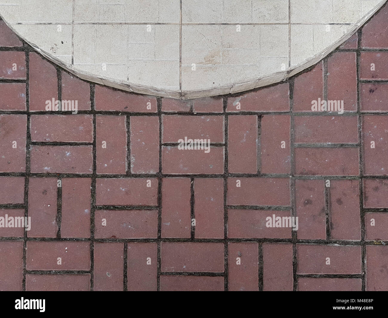Urban pavement: pink pavement square tile, top half a circle of white ...