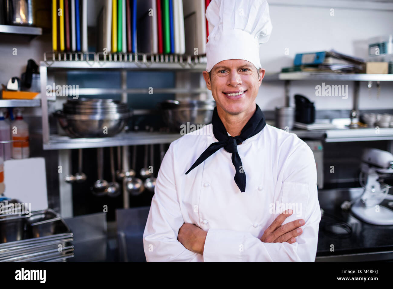 Portrait of chef posing in commercial kitchen Stock Photo - Alamy
