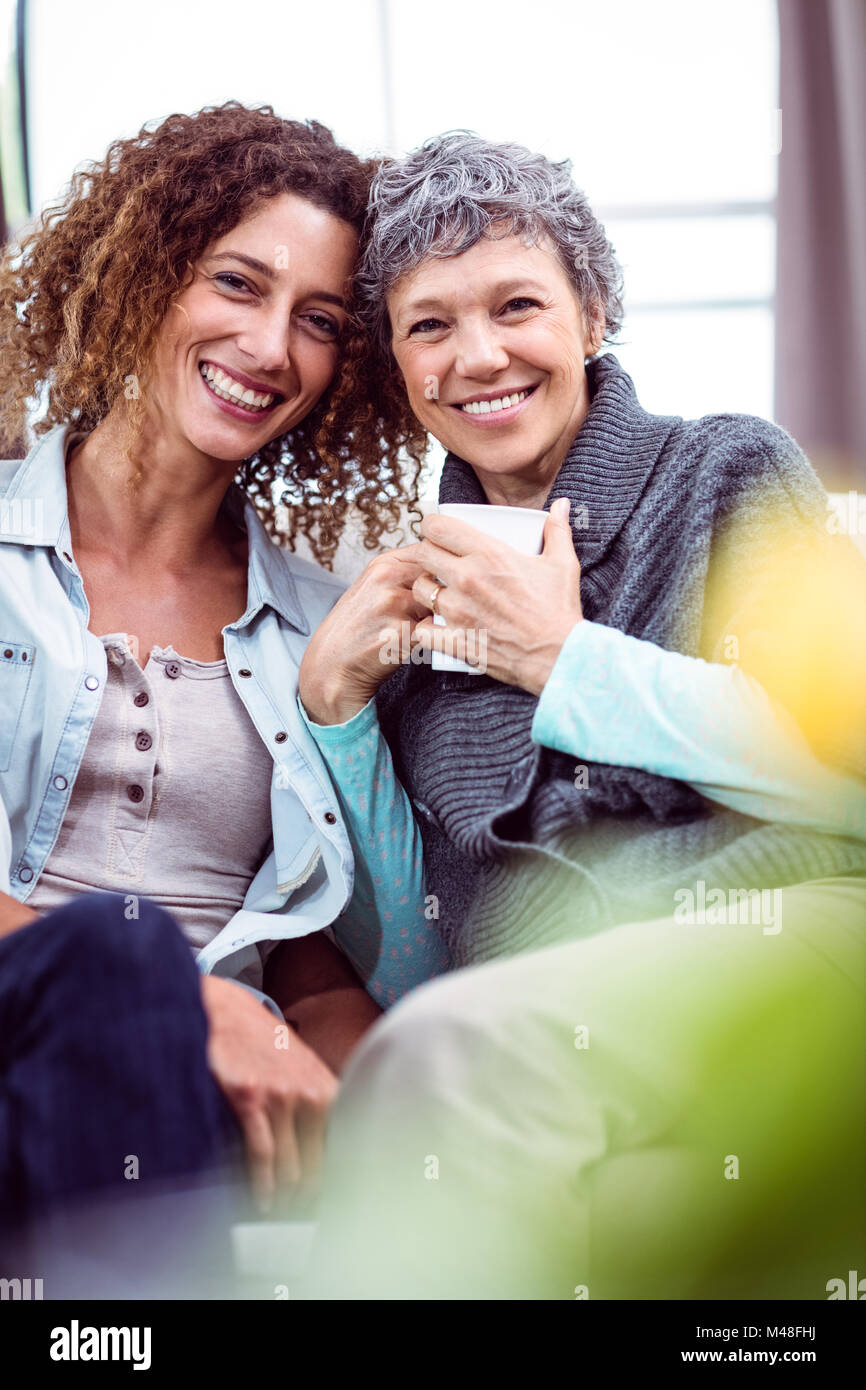 Portrait of happy mother and daughter with coffee mug Stock Photo - Alamy