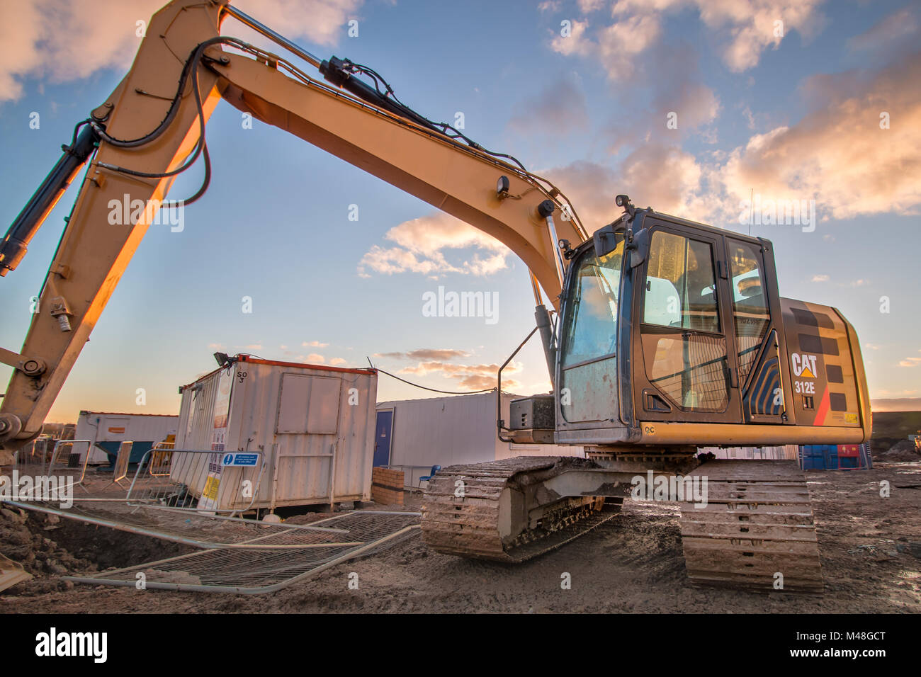 A digger on a construction site Stock Photo - Alamy