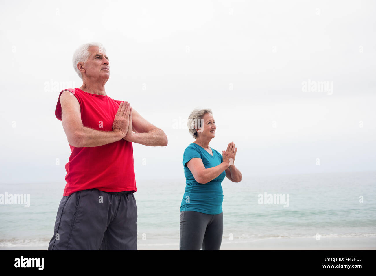 Couple in lotus position hi-res stock photography and images - Alamy