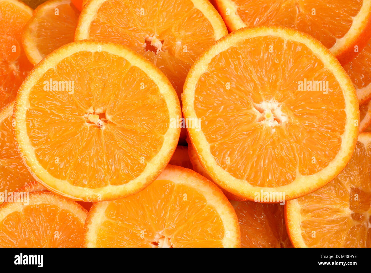 Orange round slices, cut in circles with white centers and thick coarse ...