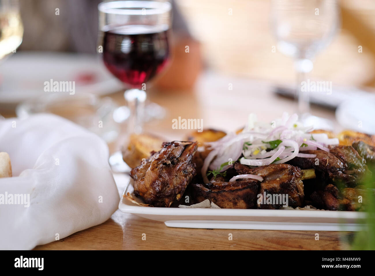 Kebab with glass of wine Stock Photo - Alamy
