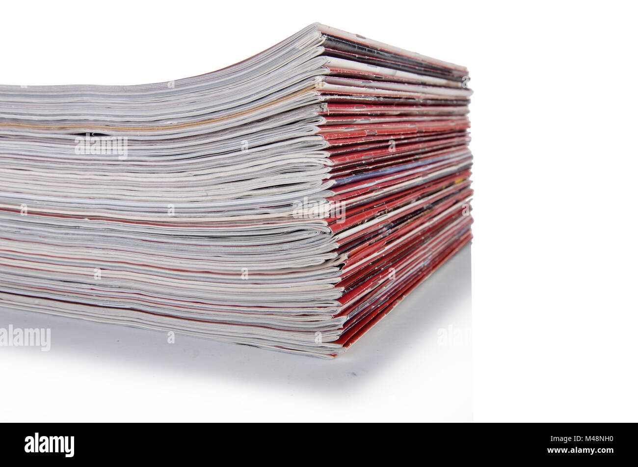 Stack of magazine isolated on the white background Stock Photo - Alamy