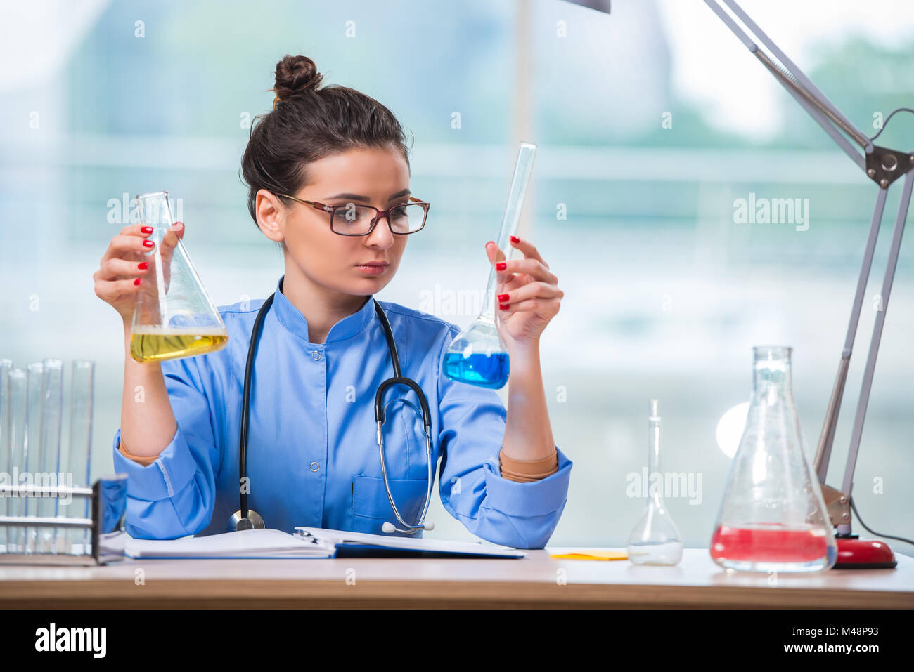 The woman doctor doing chemical tests in laboratory Stock Photo - Alamy