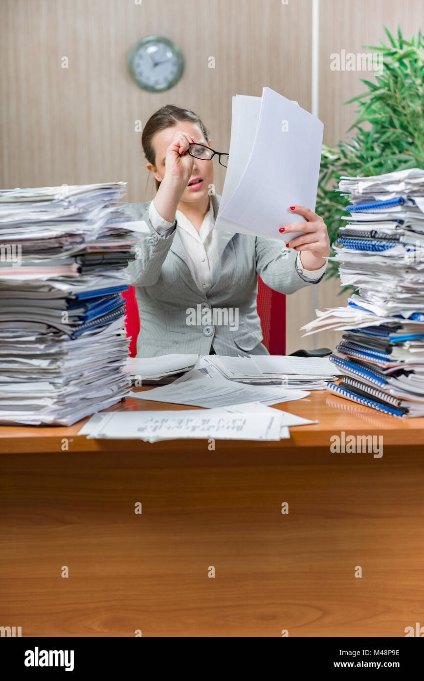 The woman under stress from excessive paper work Stock Photo - Alamy