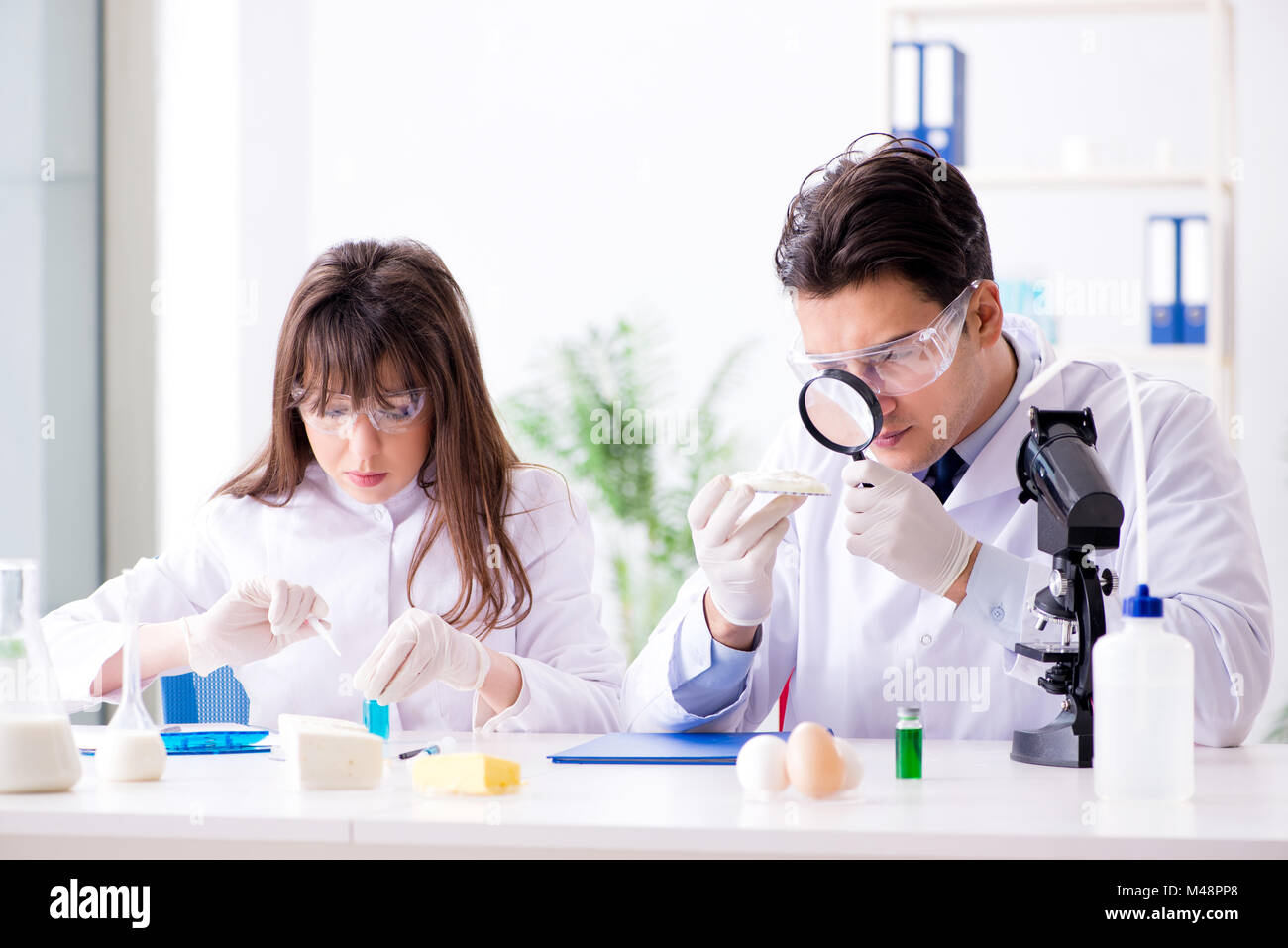 Two lab doctor testing food products Stock Photo - Alamy