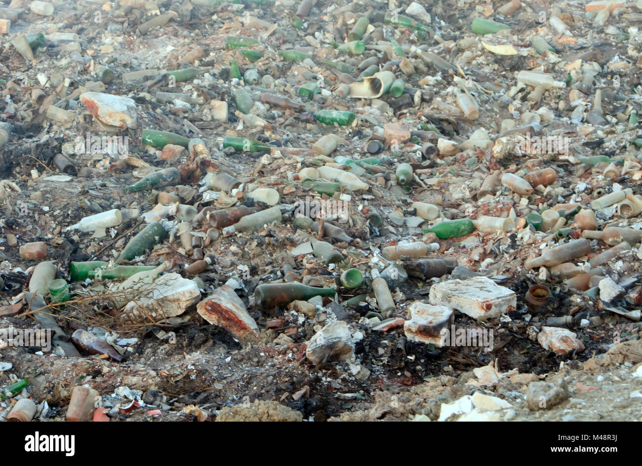 Large garbage dump waste with broken bottles Stock Photo - Alamy