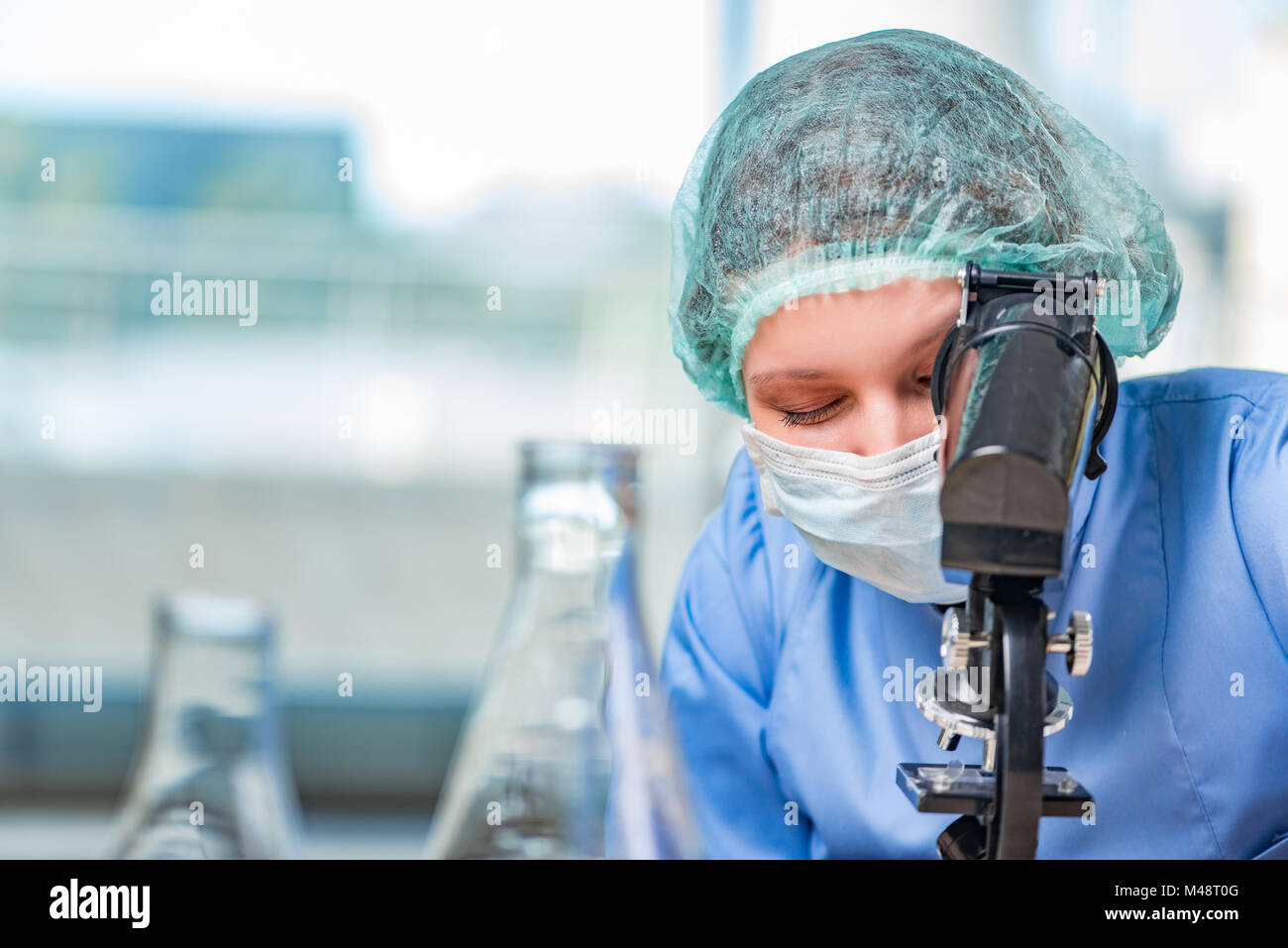 Experienced lab assistant working on chemical solutions Stock Photo - Alamy