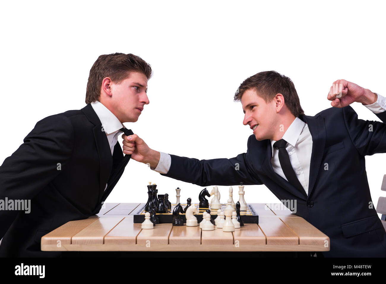 Twin brothers playing chess isolated on white Stock Photo - Alamy