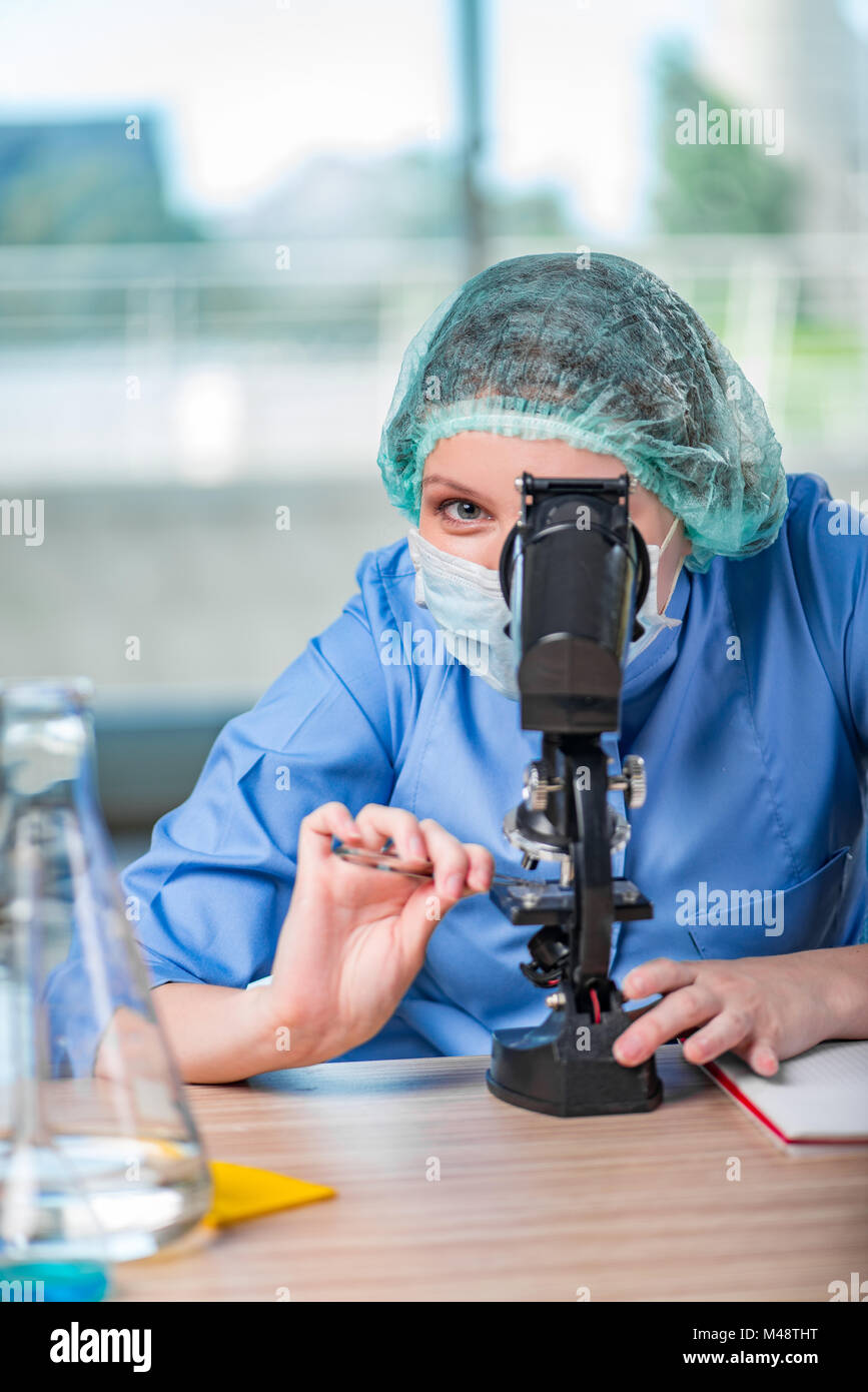 Experienced lab assistant working on chemical solutions Stock Photo - Alamy