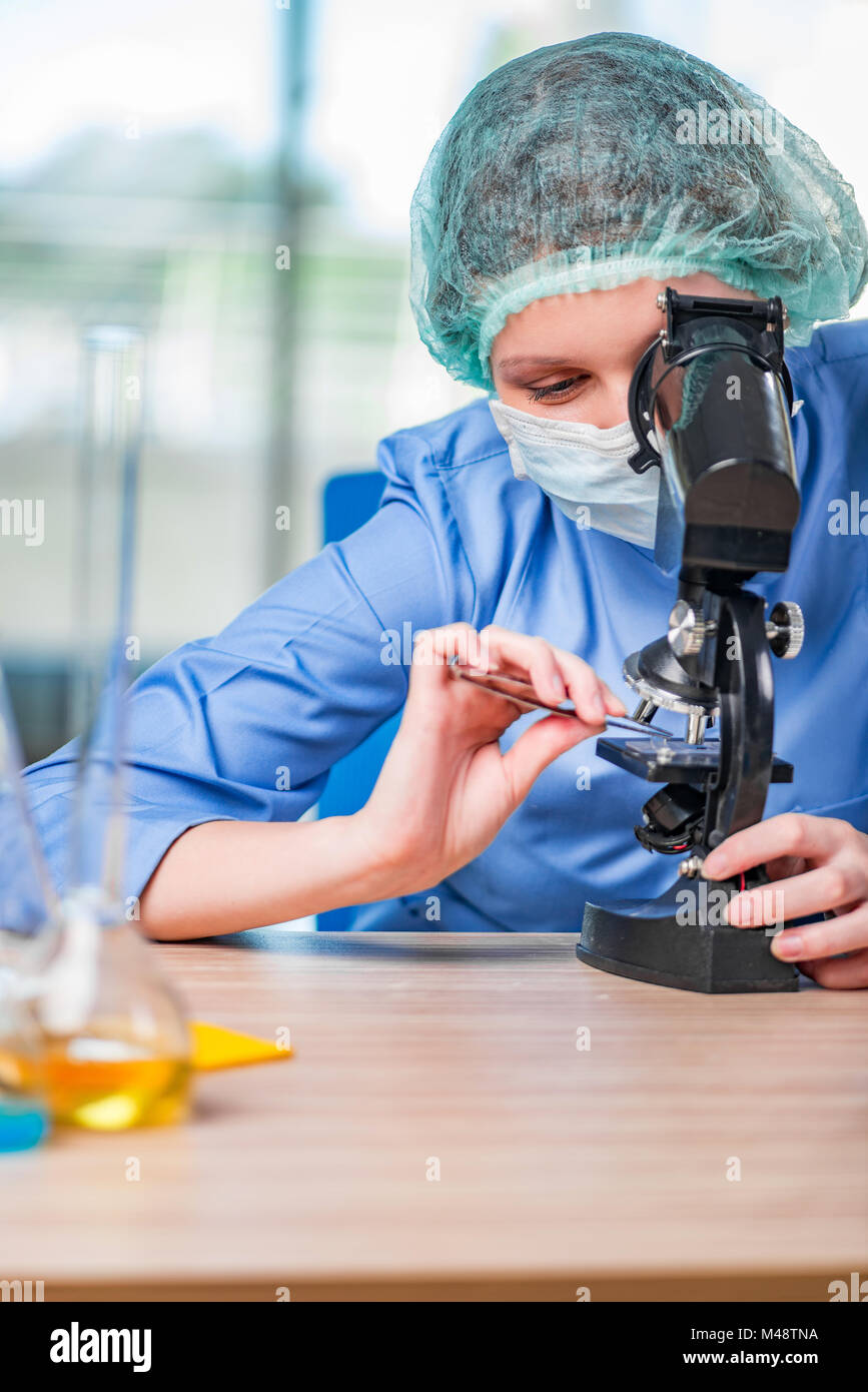 Experienced lab assistant working on chemical solutions Stock Photo - Alamy