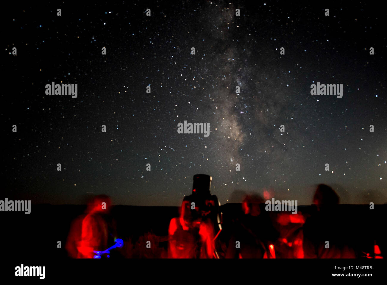 Visitors view night sky objects through a telescope. Celebrating the ...