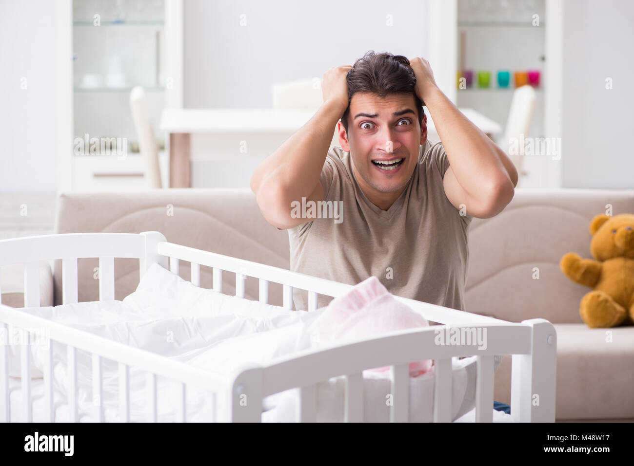 Young father dad frustrated at crying baby Stock Photo - Alamy