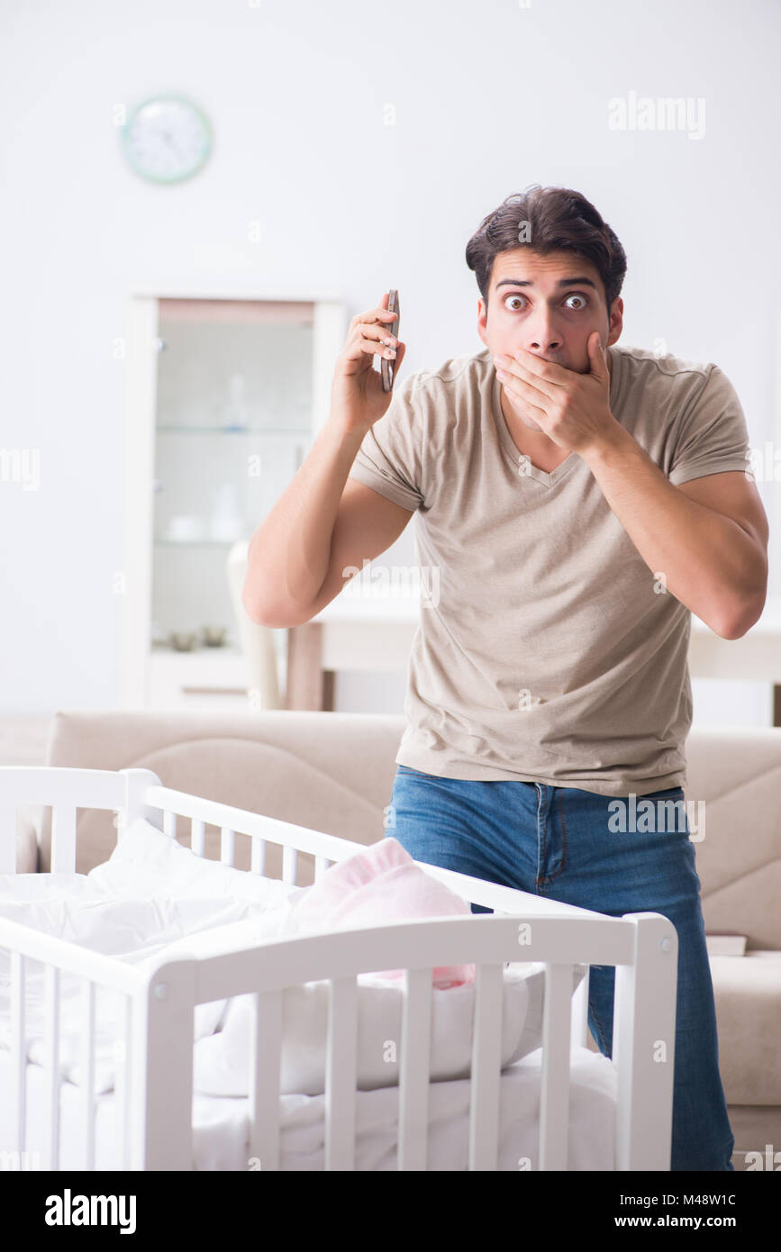 Young father dad frustrated at crying baby Stock Photo - Alamy