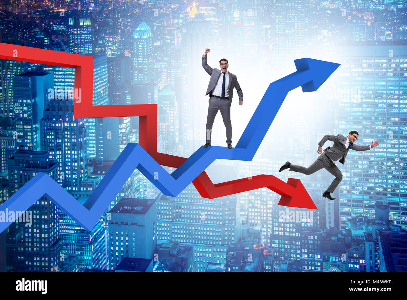 Businessman with charts of growth and decline Stock Photo - Alamy