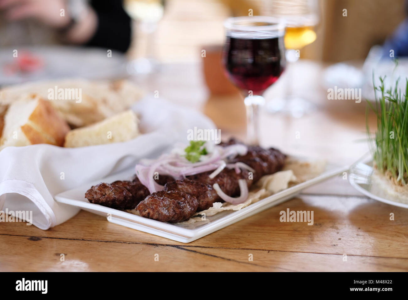 Kebab with glass of wine Stock Photo - Alamy