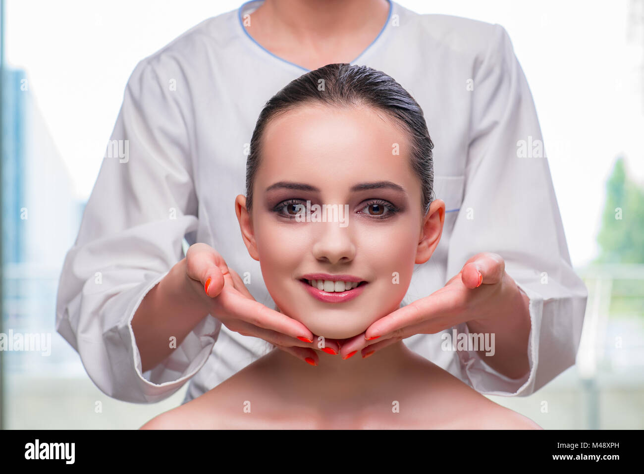 Young woman during face and skin massage session Stock Photo - Alamy