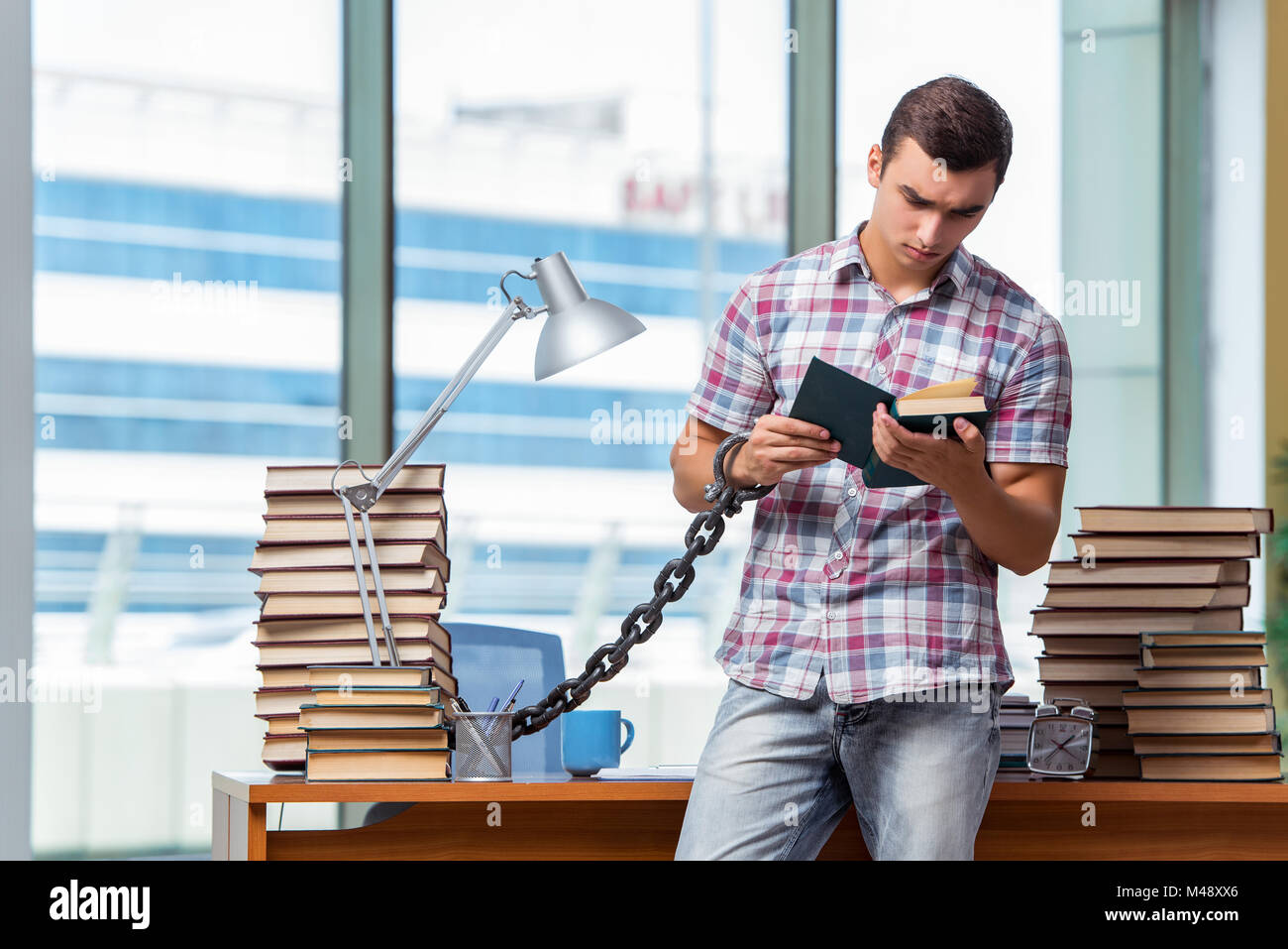 Young man preparing for graduation exams in college Stock Photo - Alamy