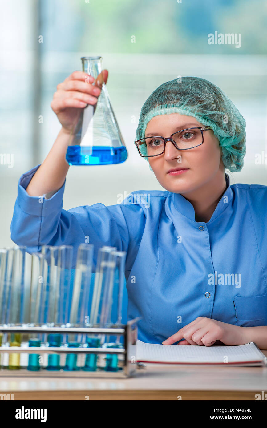 Experienced lab assistant working on chemical solutions Stock Photo - Alamy